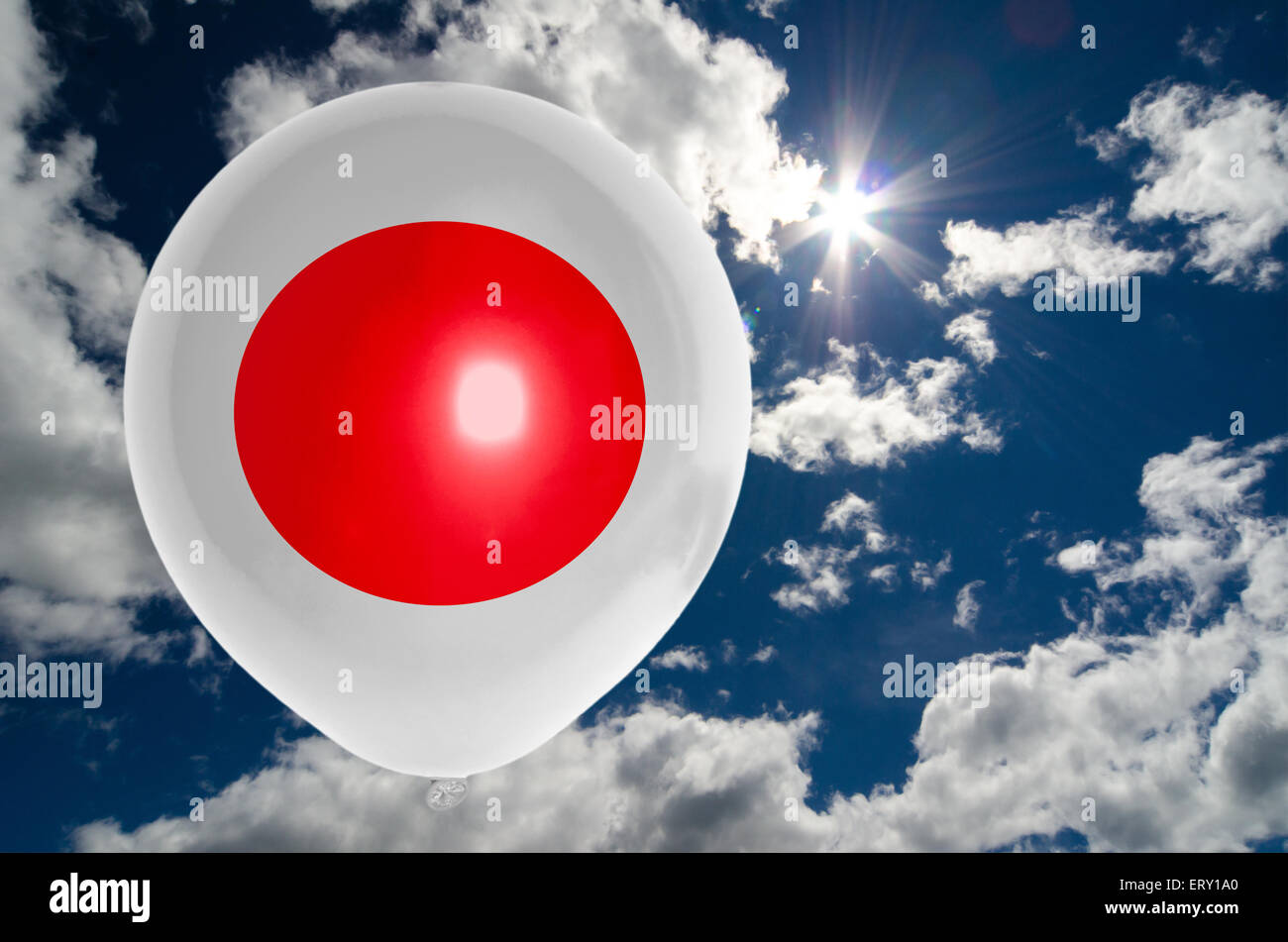 balloon in colors of japan flag flying on blue sky Stock Photo - Alamy