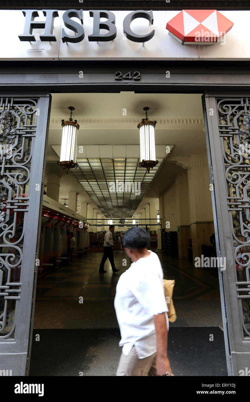 Sao Paulo, Brazil. 9th June, 2015. A woman walks past a branch office ...