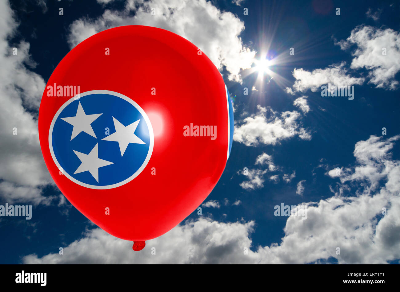balloon in colors of tennessee flag flying on blue sky Stock Photo - Alamy