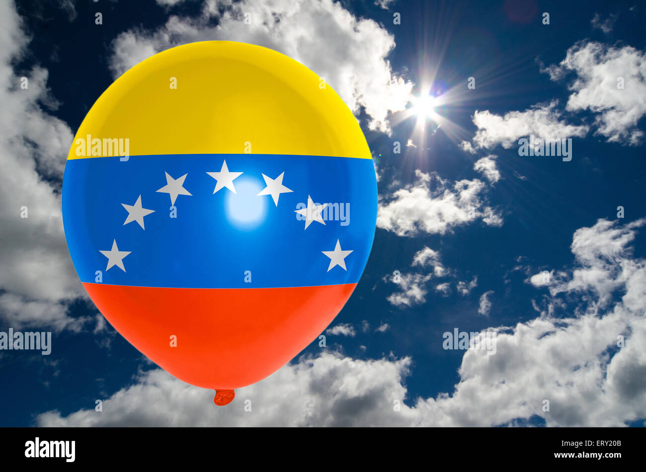 balloon in colors of venezuela flag flying on blue sky Stock Photo - Alamy