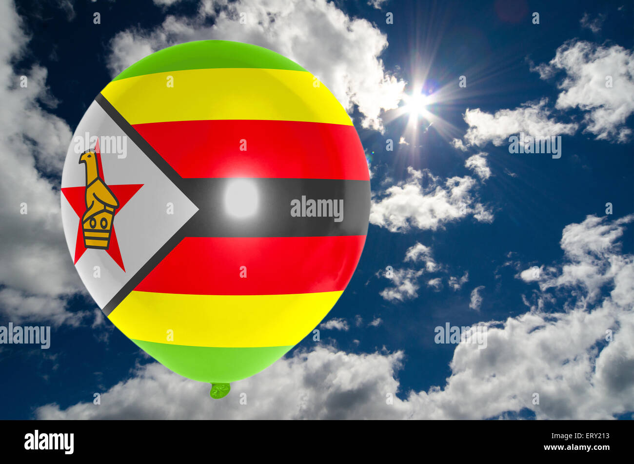 balloon in colors of zimbabwe flag flying on blue sky Stock Photo - Alamy