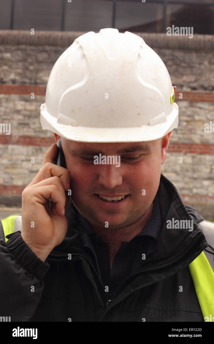 An engineer talking on his mobile phone Stock Photo - Alamy