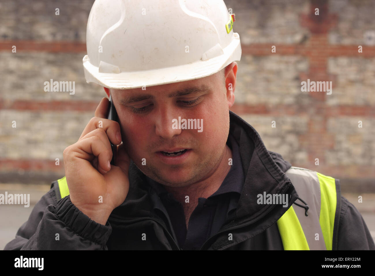 An engineer talking on his mobile phone Stock Photo - Alamy