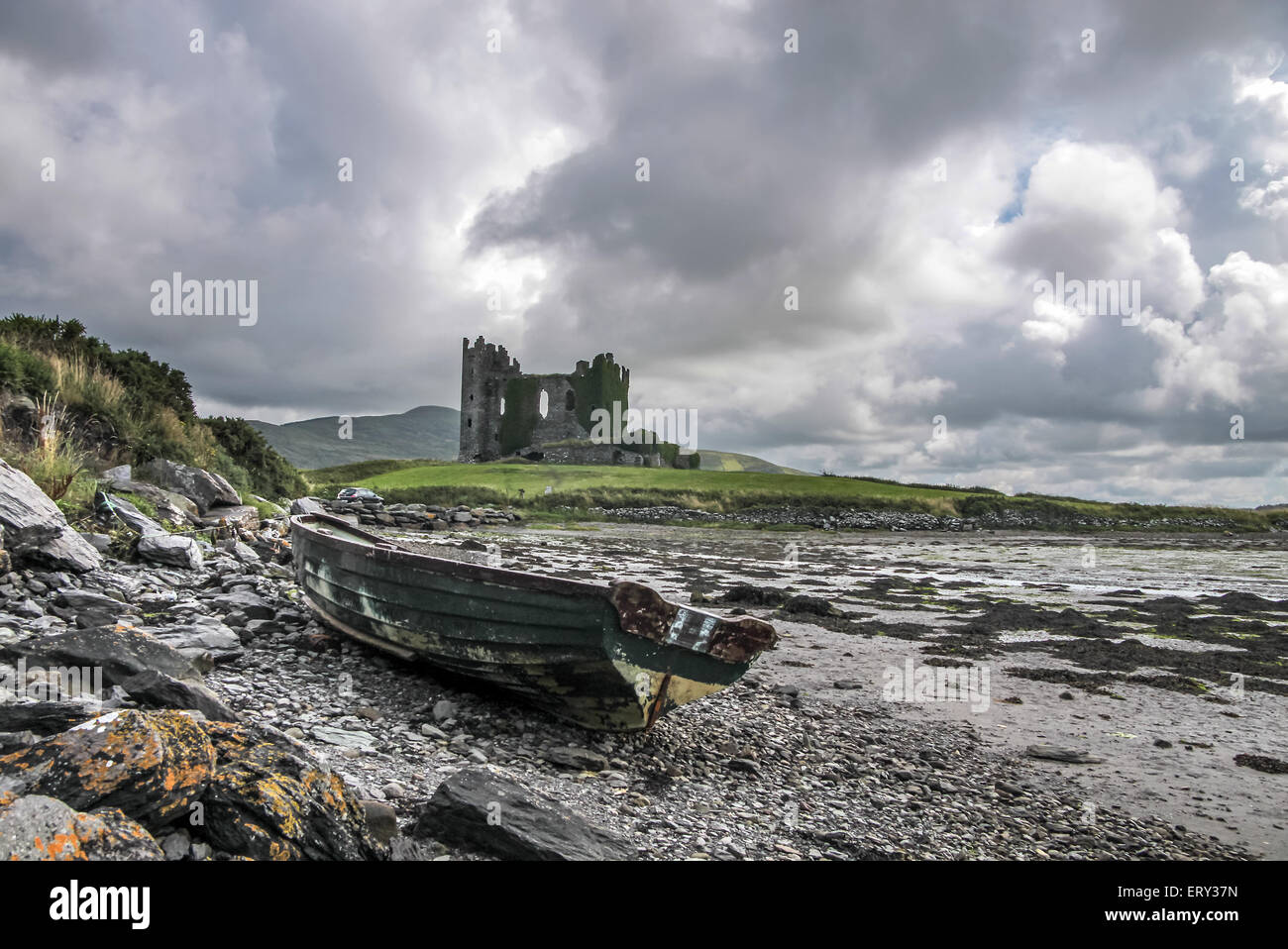 Ballycarbery Castle with old boat on the Ring of Kerry in Cahersiveen ...