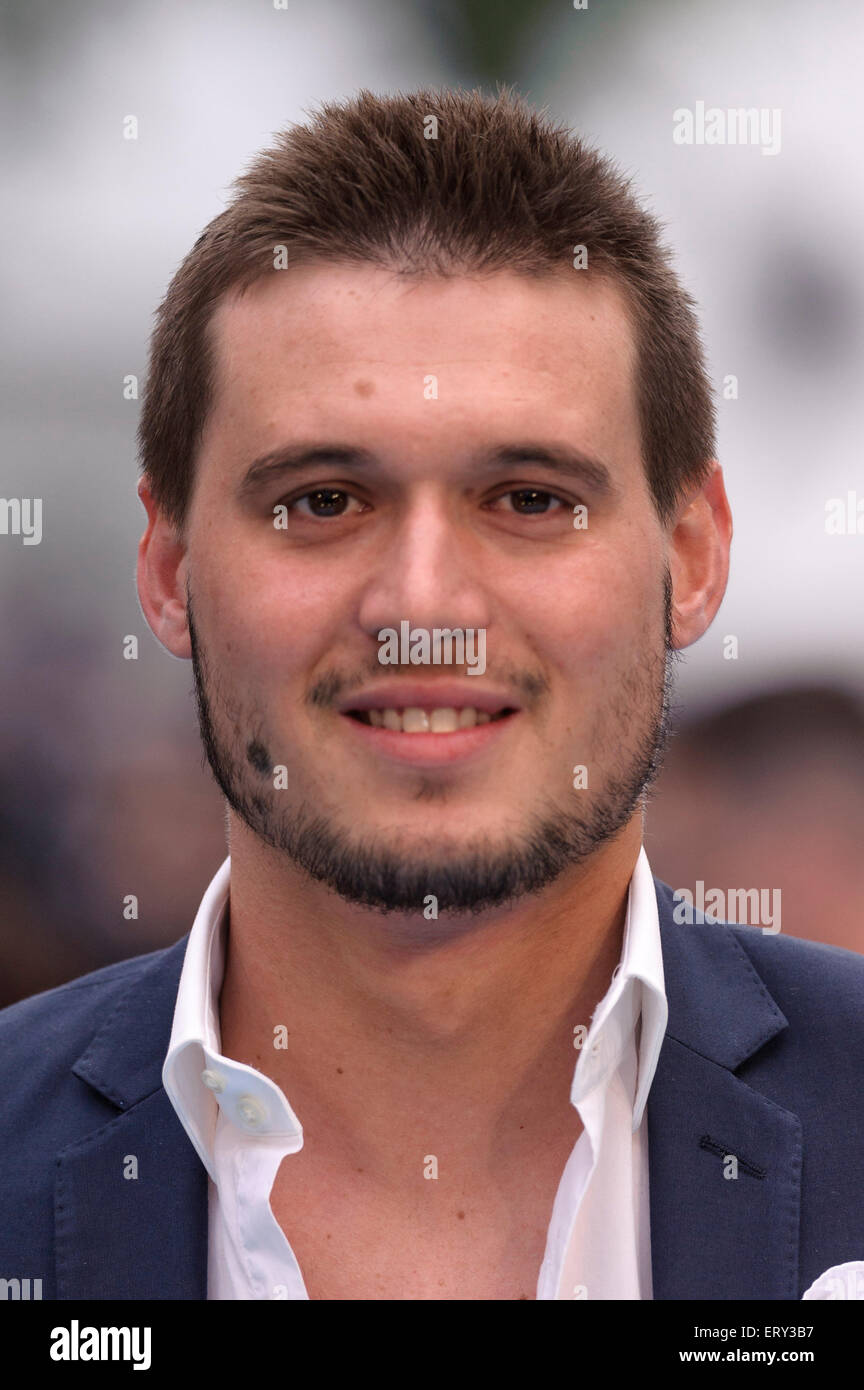 Charlie Sims arrives on the blue carpet for the the European premiere ...