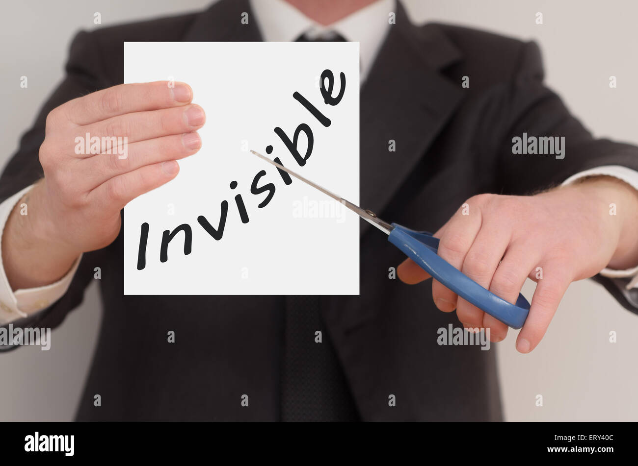Invisible, man in suit cutting text on paper with scissors Stock Photo ...