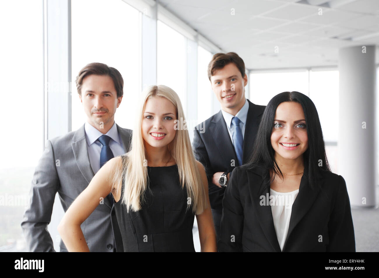 Happy business team of coworkers in office Stock Photo - Alamy