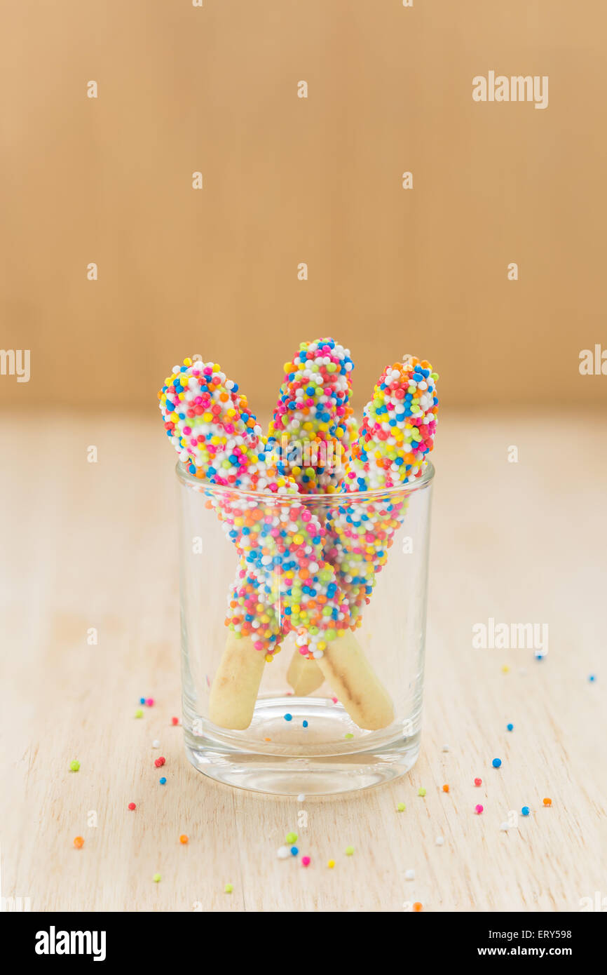 Sweet bread sticks with chocolate and colorful sugar sprinkles Stock ...