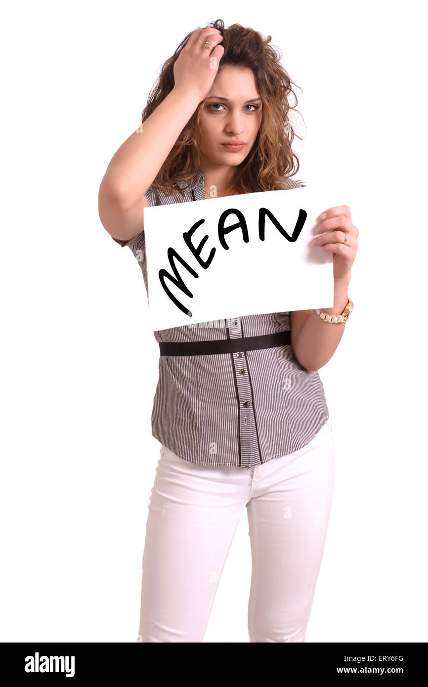 Young attractive woman holding paper with Mean text on white background ...