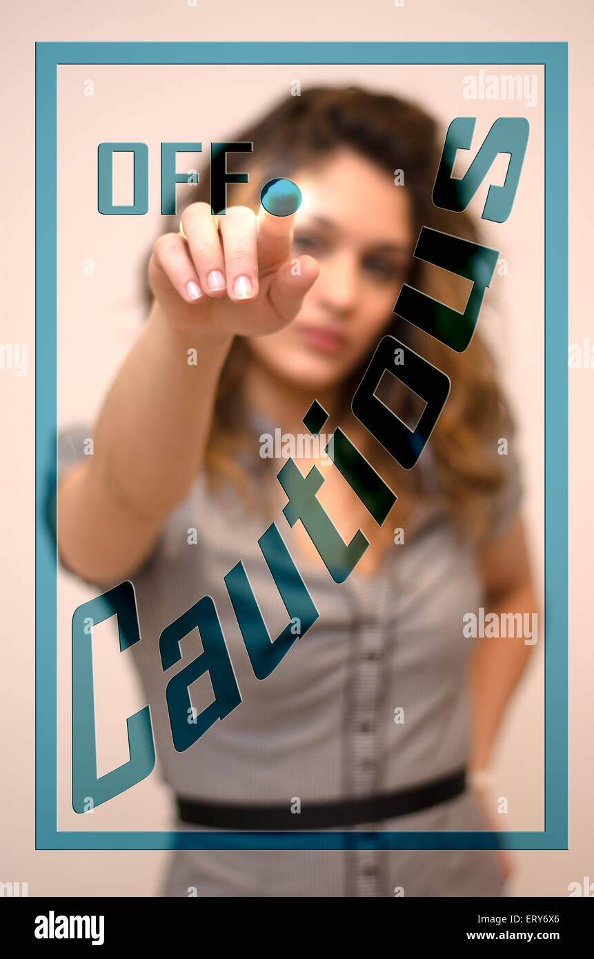 young woman turning off Cautious on screen Stock Photo - Alamy