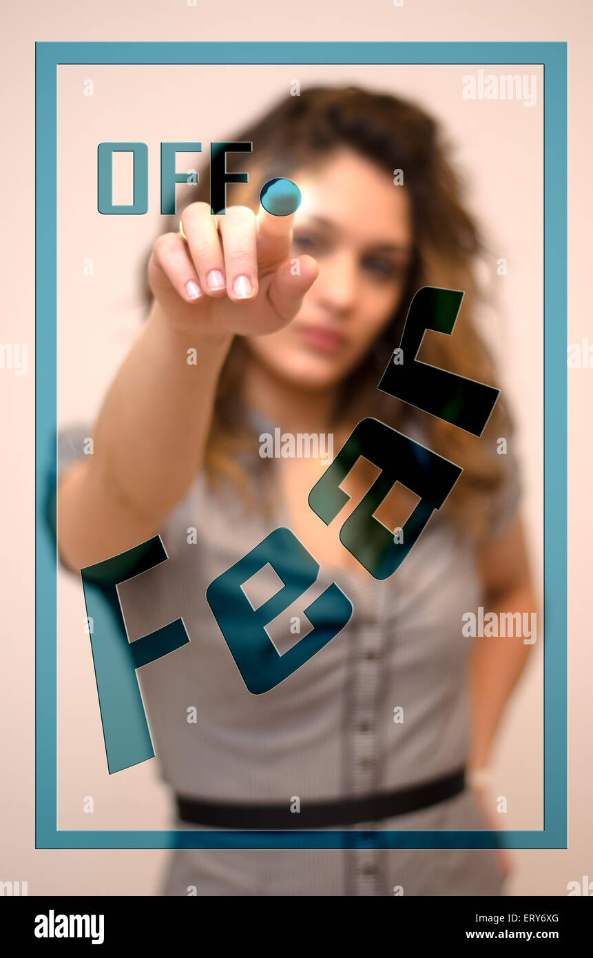 young woman turning off Fear on screen Stock Photo - Alamy