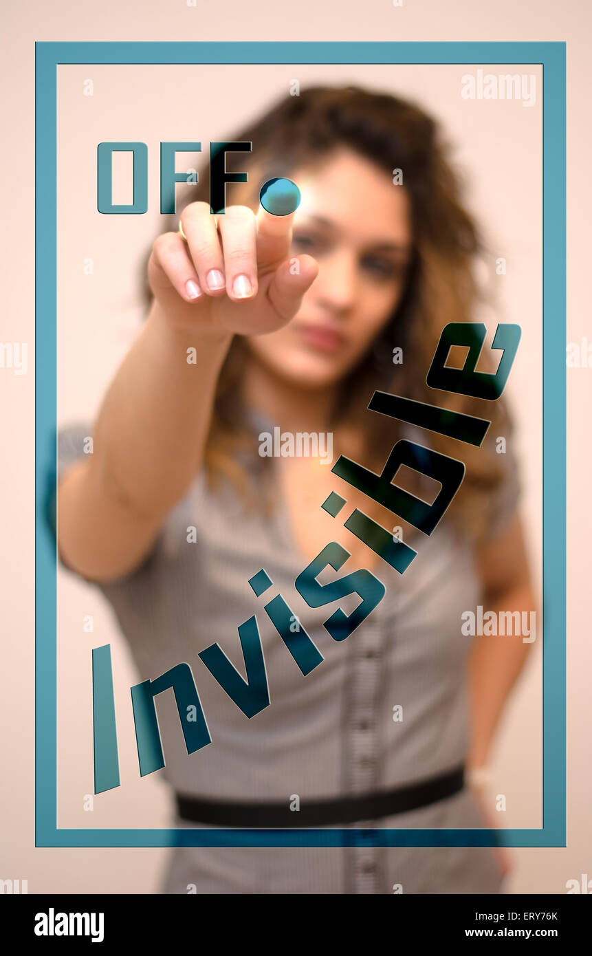 young woman turning off Invisible on digital panel Stock Photo - Alamy
