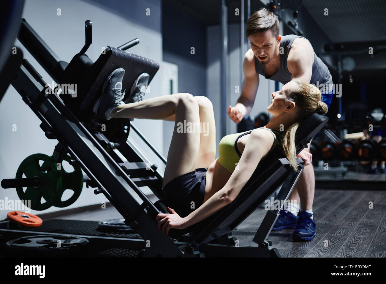 Exercising legs on gym equipment hi-res stock photography and images ...