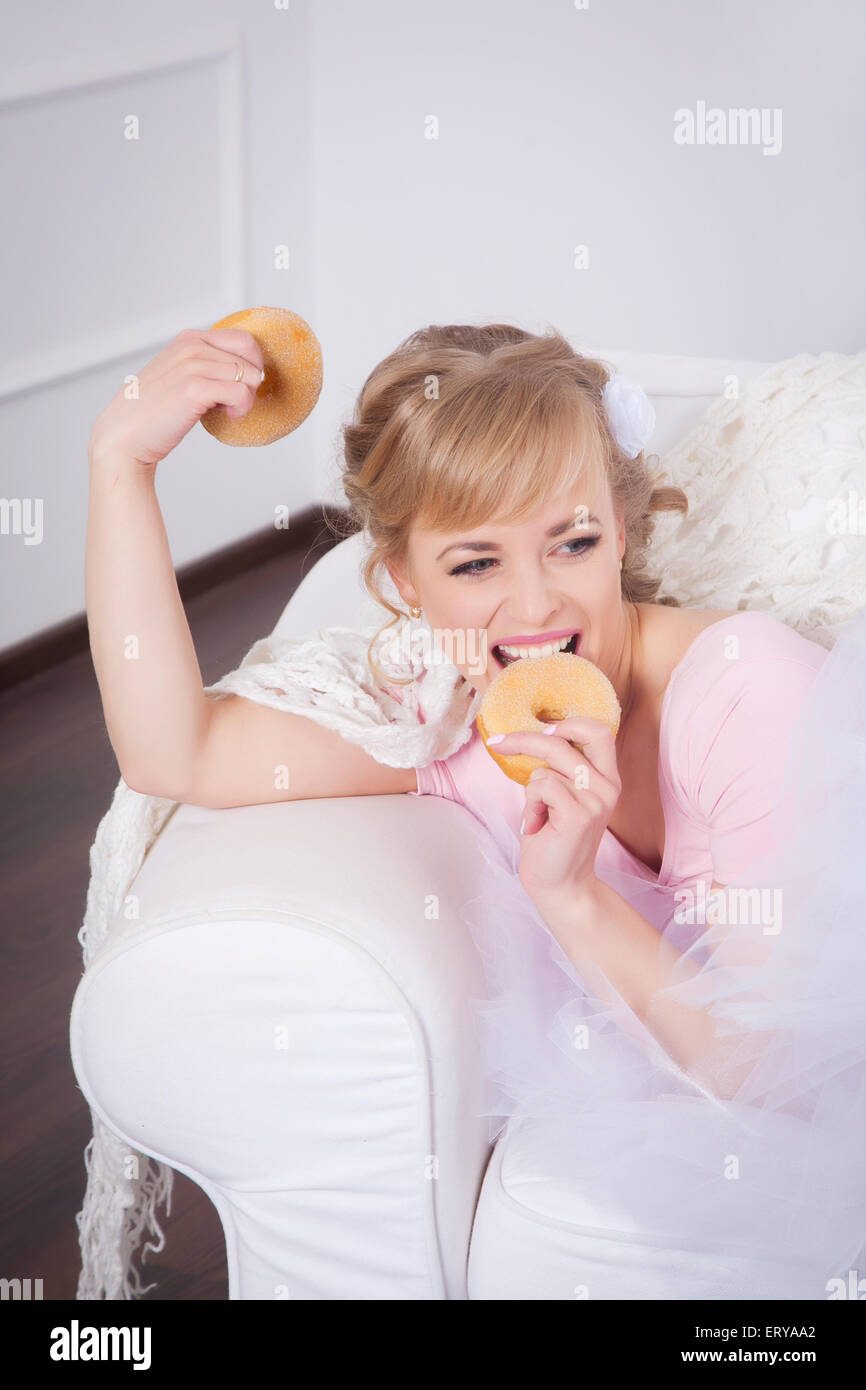 Young lady eat donut hi-res stock photography and images - Alamy
