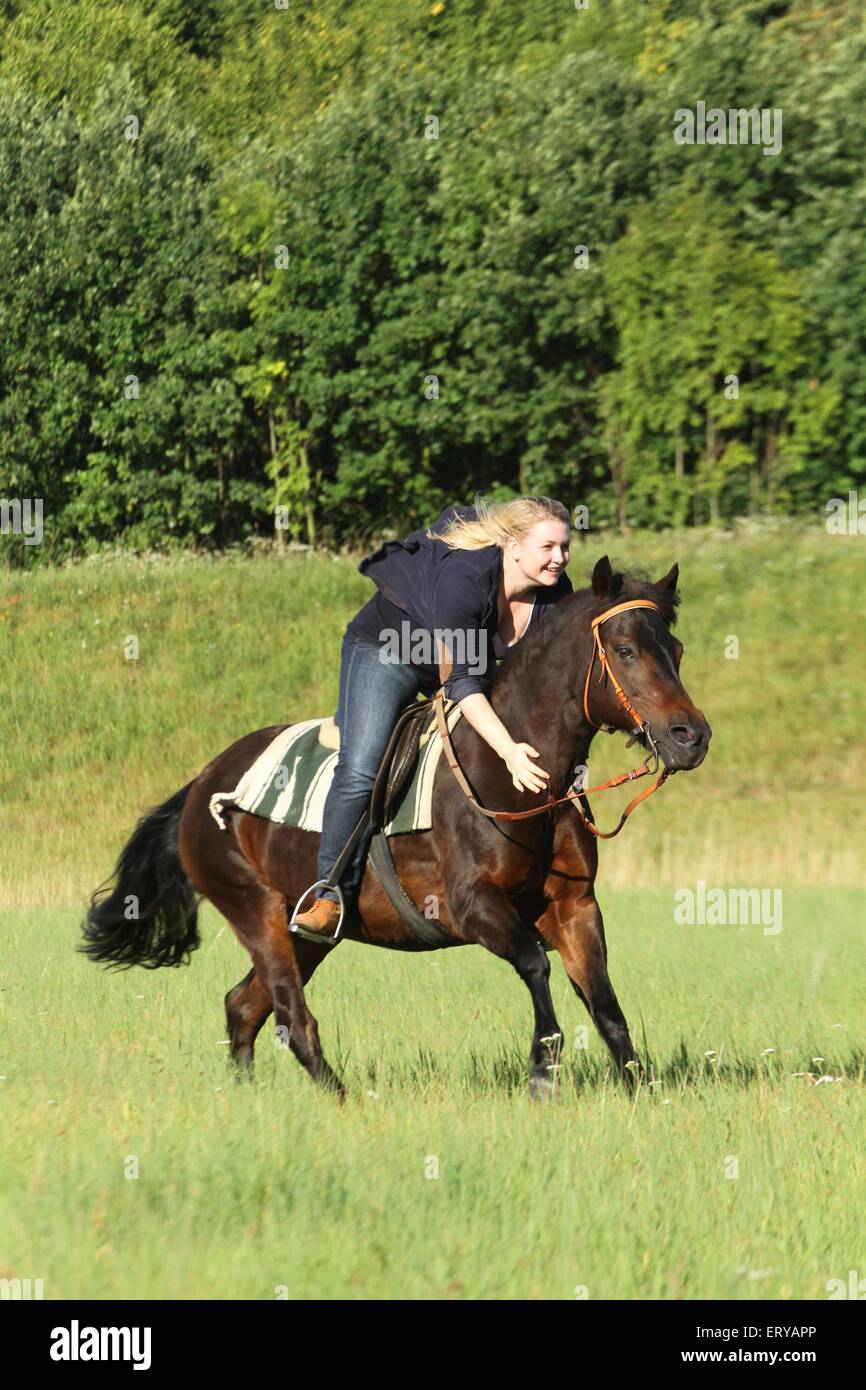 woman rides pony Stock Photo - Alamy