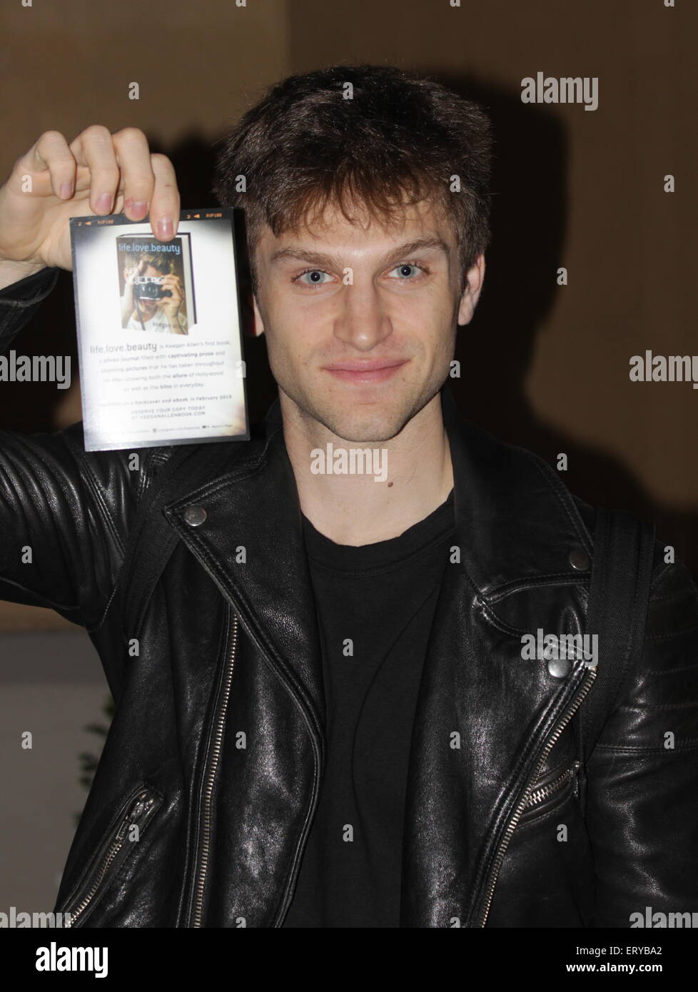 Keegan Allen goes shopping at The Grove, carrying a motorcycle helmet ...