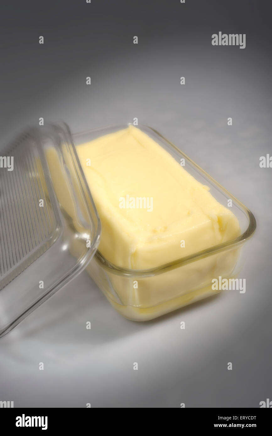 butter in glass butter box on gray background Stock Photo - Alamy