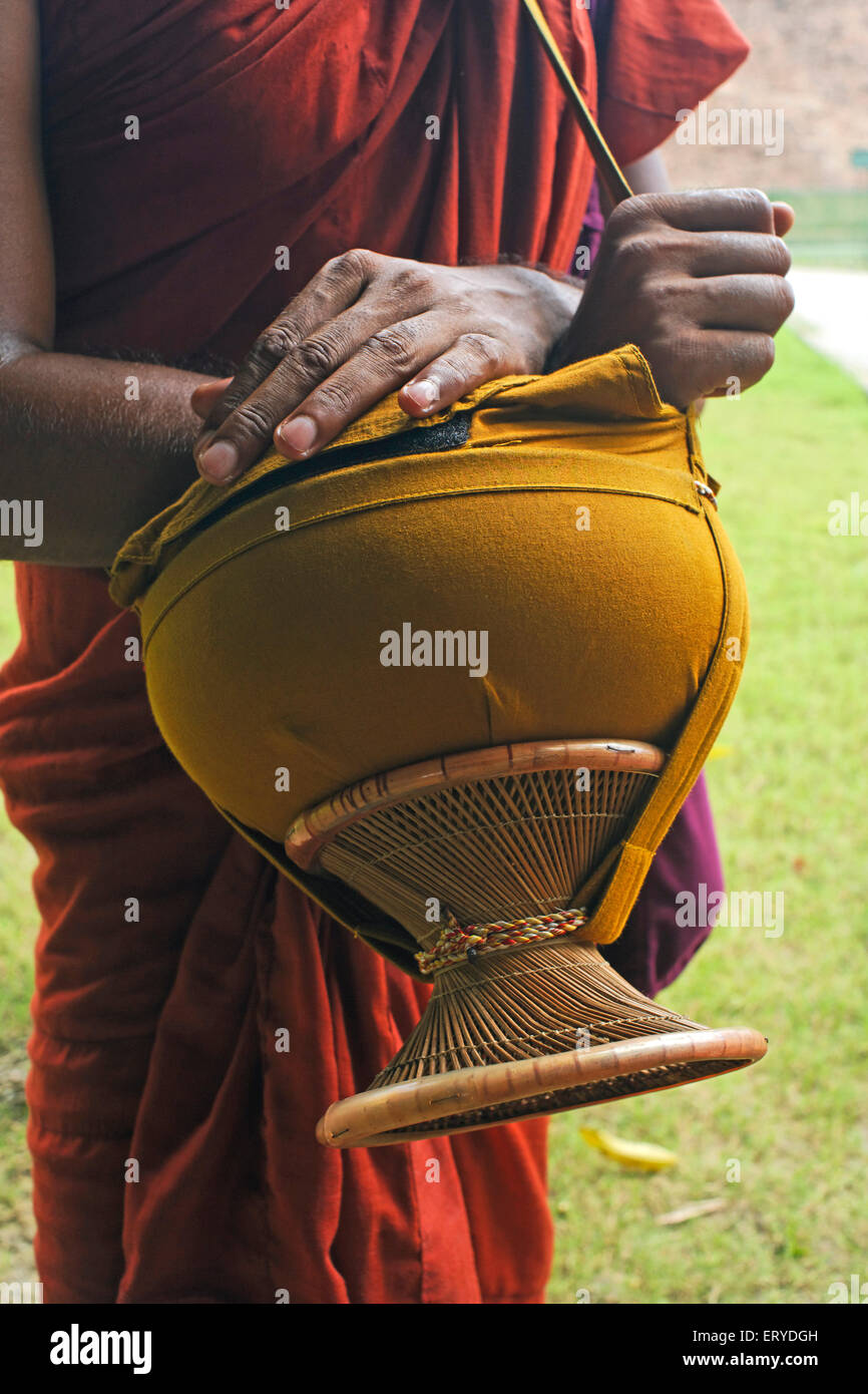 Buddhist monk with begging bowl ; alms bowl , Kushi Nagar ; kushinagar ...