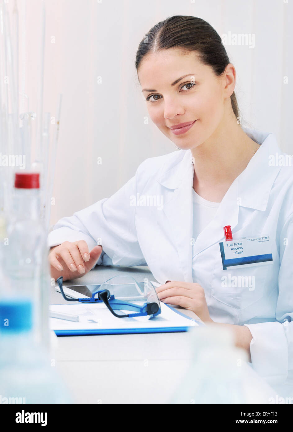 chemical laboratory scene: attractive young student scientist observing ...
