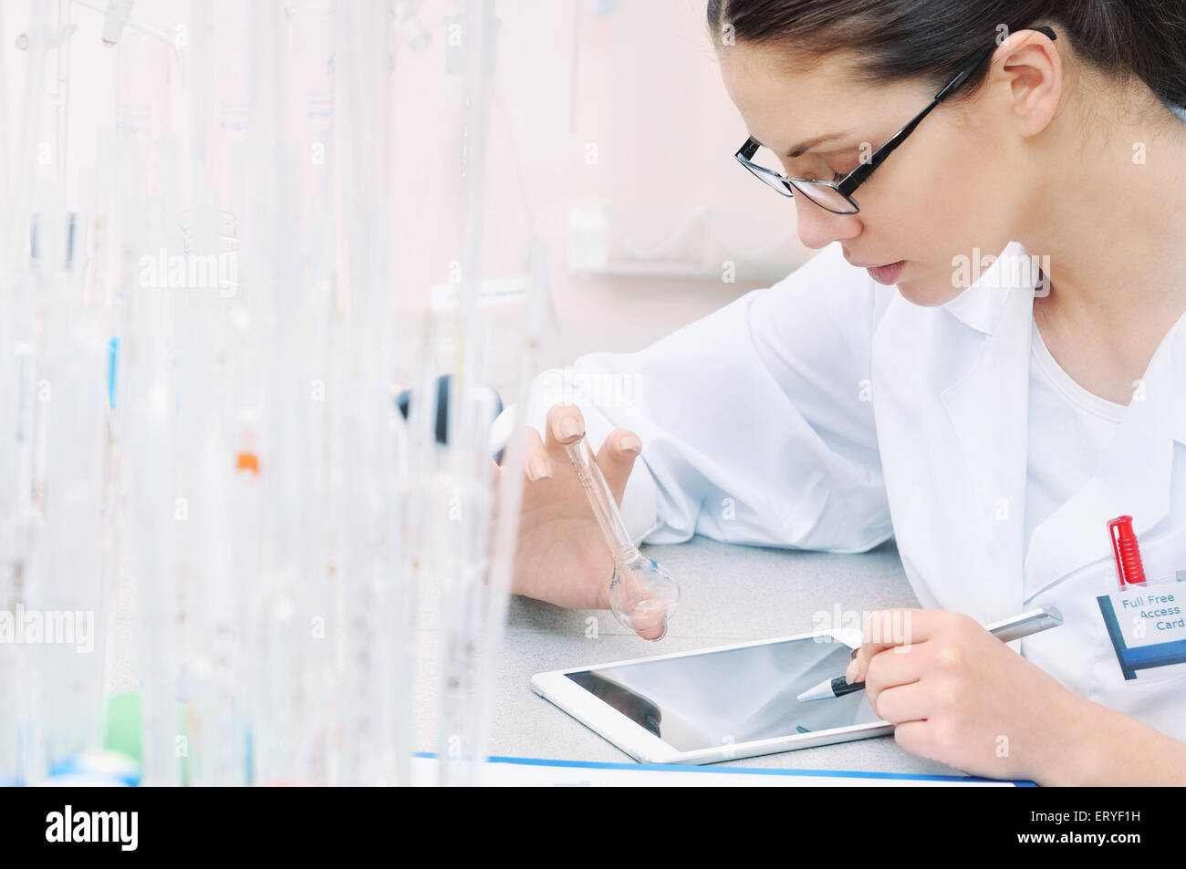 chemical laboratory scene: attractive young student scientist observing ...