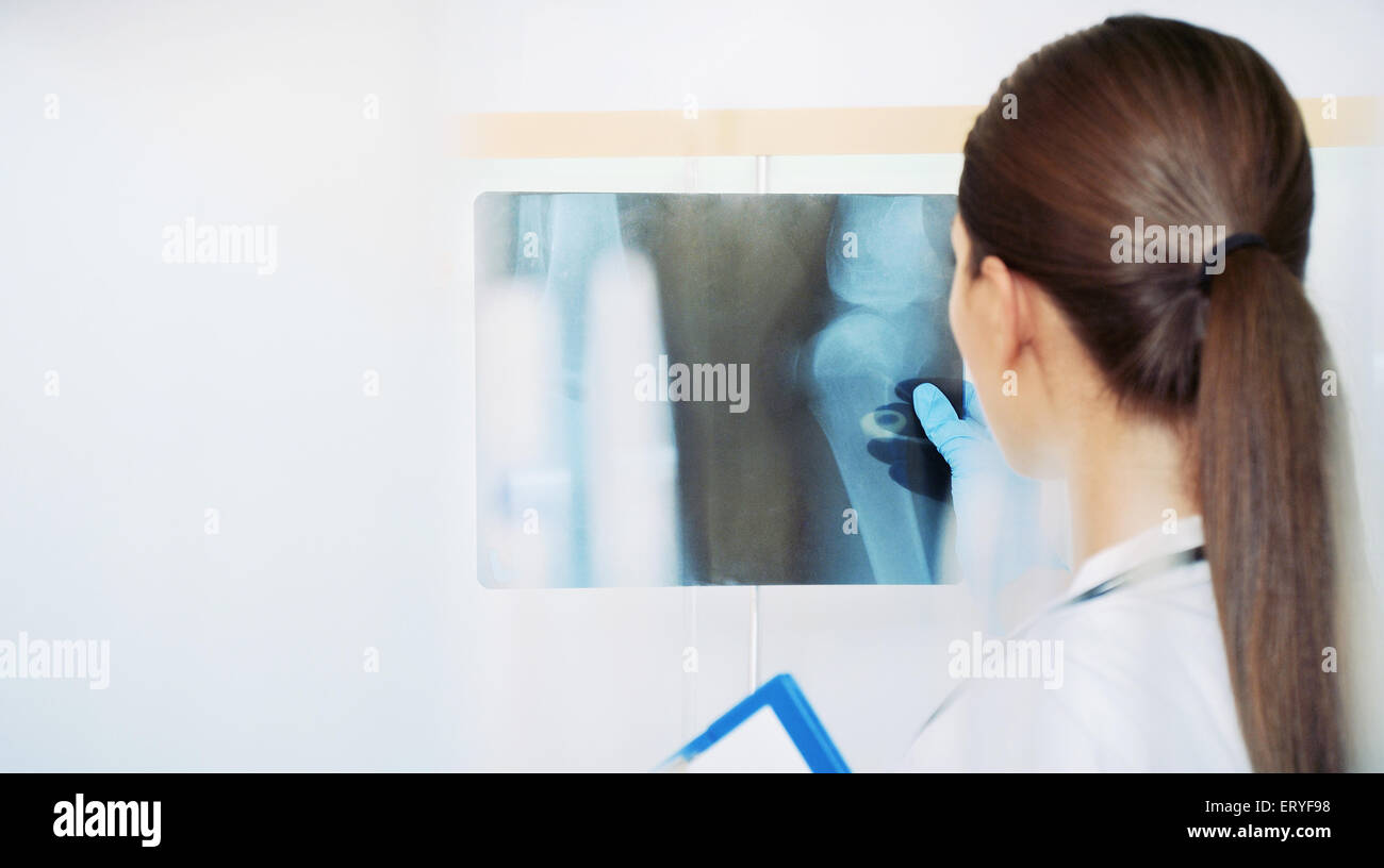chemical laboratory scene: attractive young student scientist observing ...