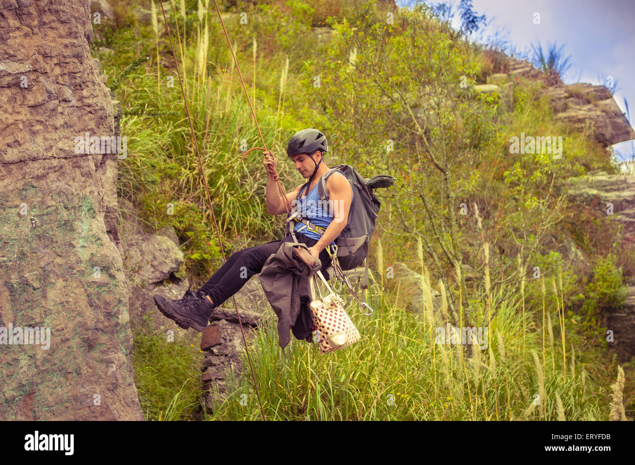 man rapelling down mountainside Stock Photo - Alamy