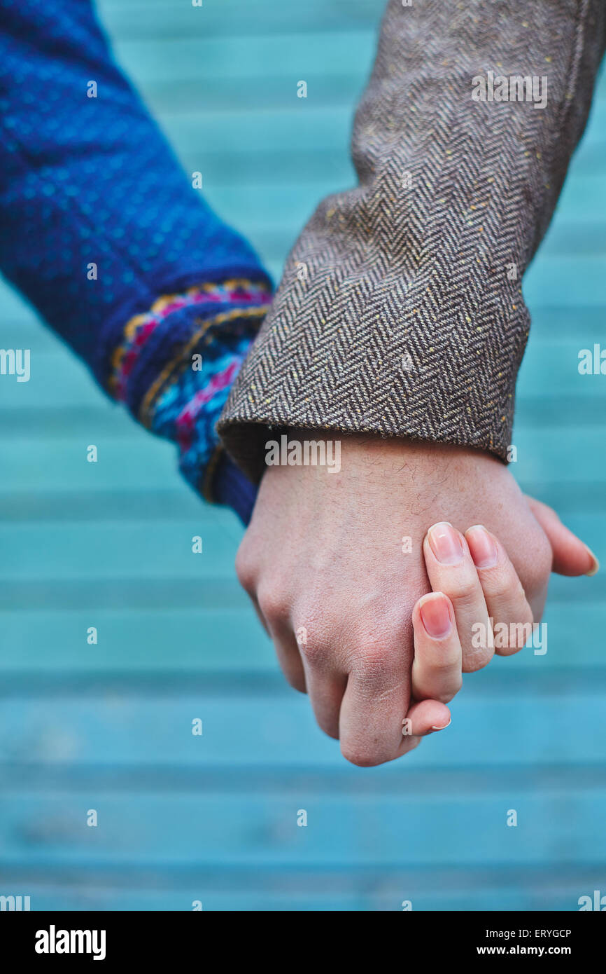 Hands of young couple Stock Photo - Alamy