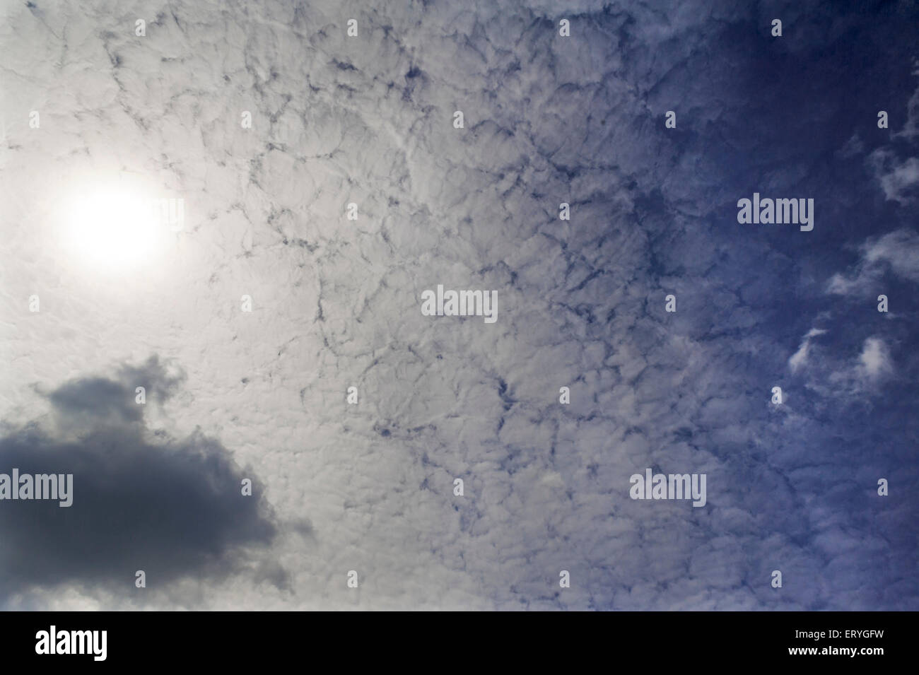Sun hidden by slight cloud cover Stock Photo - Alamy