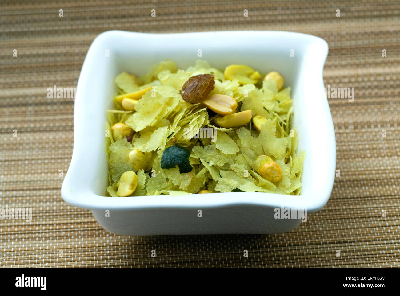 Snacks ; rice flakes fried yellow pohe pohyacha chivda in tray Stock ...