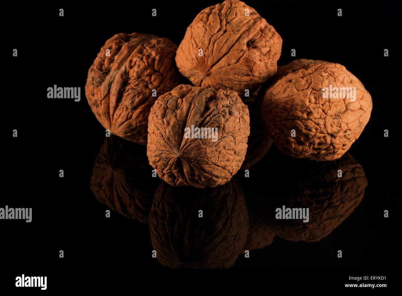 Close up nuts on black background with reflection Stock Photo - Alamy