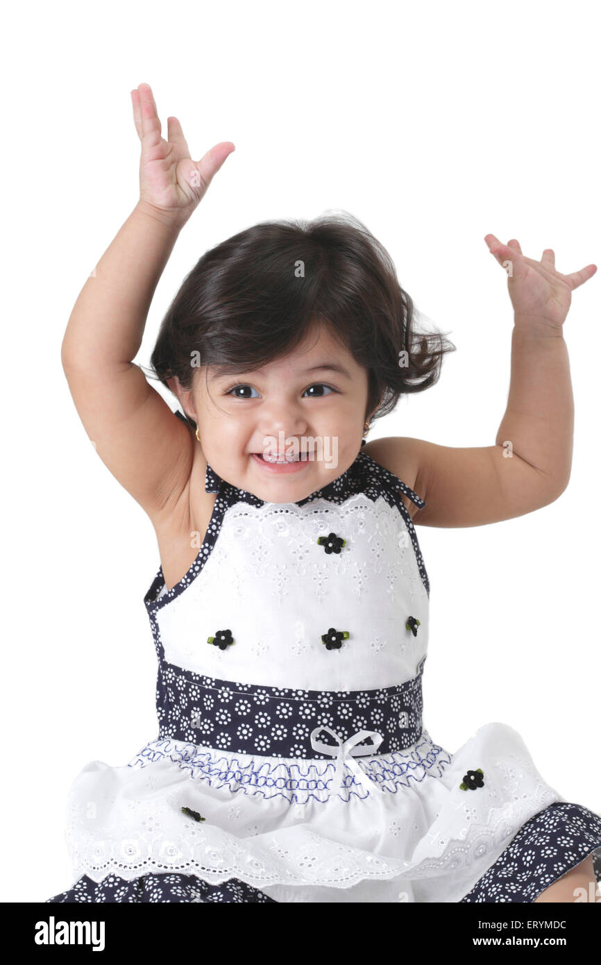 Fifteen month old baby girl raising both hands MR#743S Stock Photo - Alamy