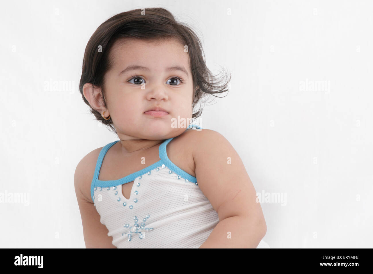 Fifteen month old baby girl staring MR#743S Stock Photo - Alamy