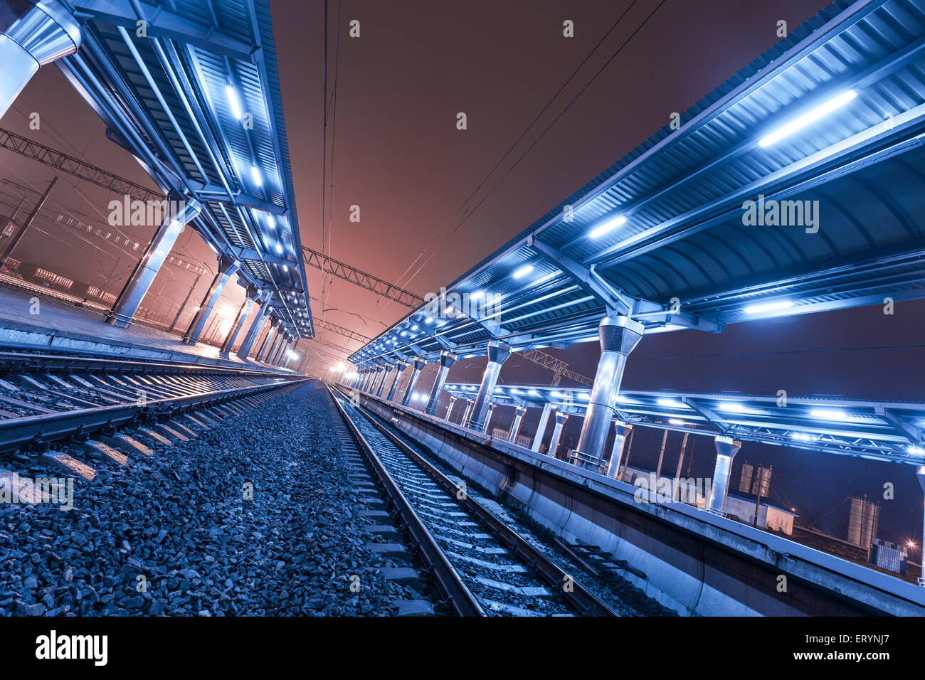 Railway station at night. Train platform in fog. Railroad in Donetsk ...