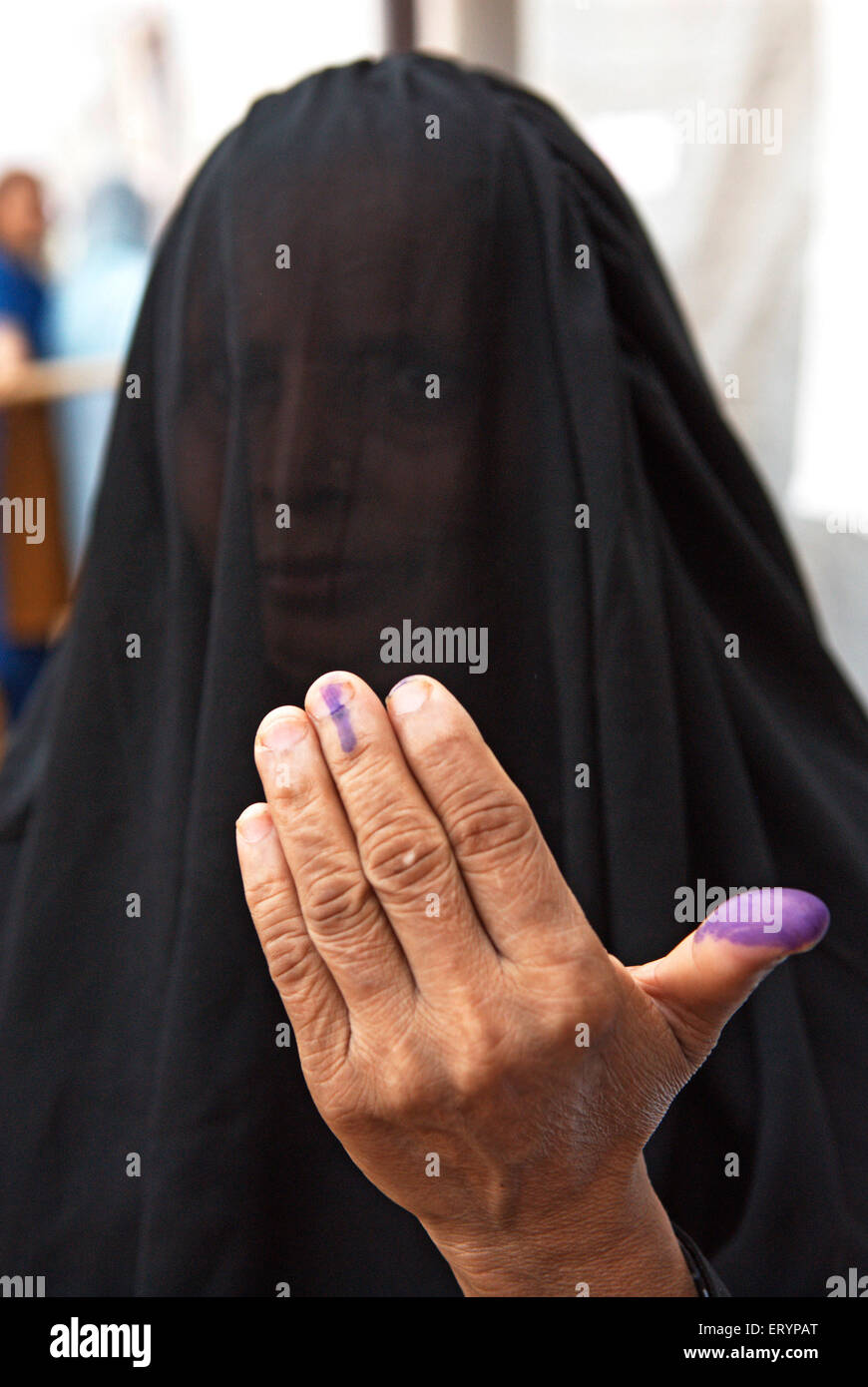 Indian elections , woman in burka showing voting mark on finger ...