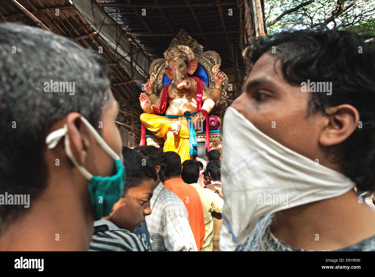 Men wearing protective masks for virus safety ; Bombay ; Mumbai ...
