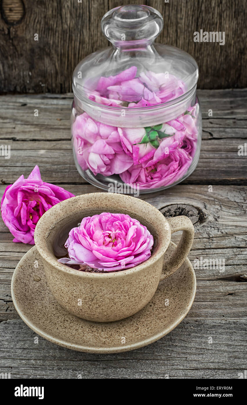 Cup with fresh fragrant herbal decoction of tea rose.The image is ...