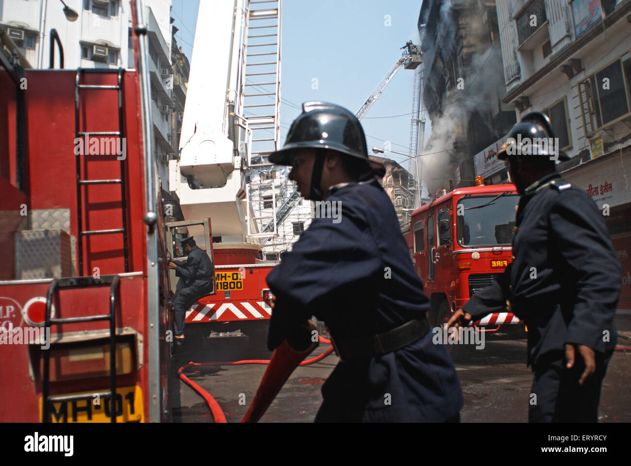 Firemen fighting fire in Johri Mansion, Kalbadevi, Bombay, Mumbai ...