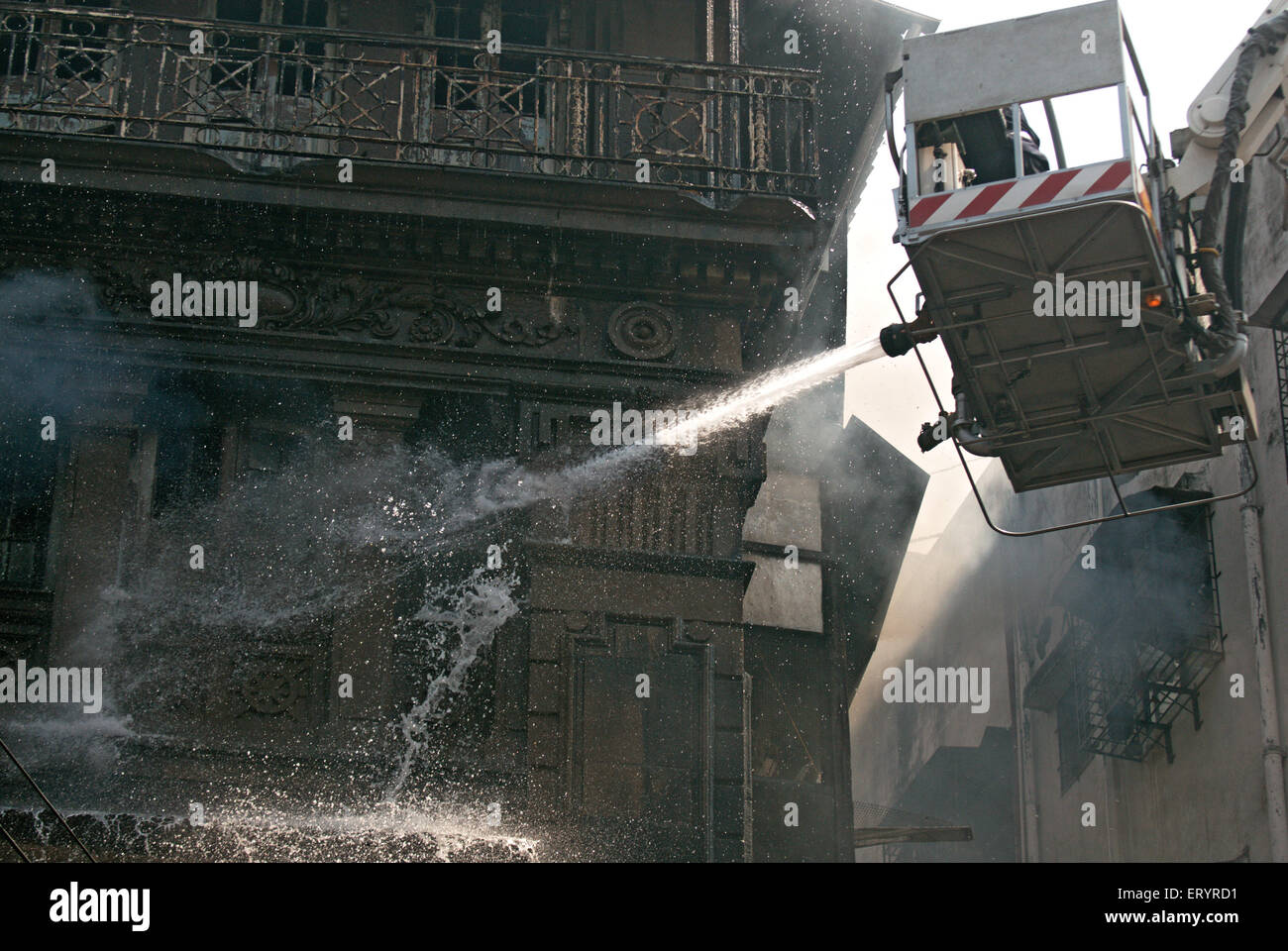 Firemen dousing fire in Johri Mansion , Kalbadevi , Bombay , Mumbai ...