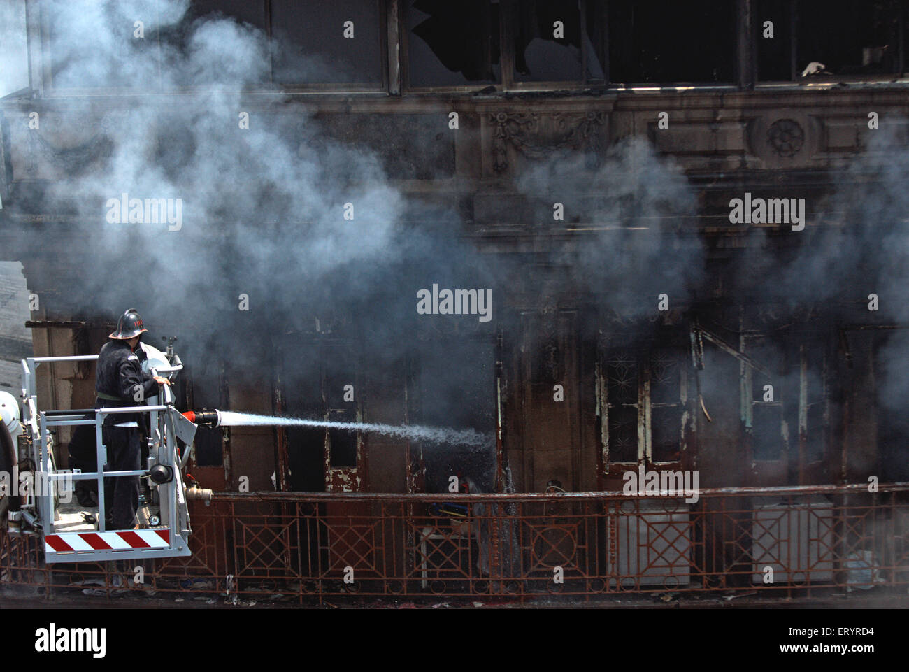 Firemen dousing fire in Johri Mansion at Kalbadevi ; Bombay Mumbai ...