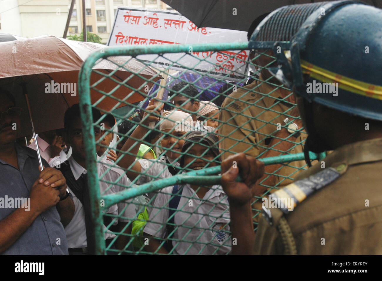Indian protest , school children and parents protesting in rain , New ...