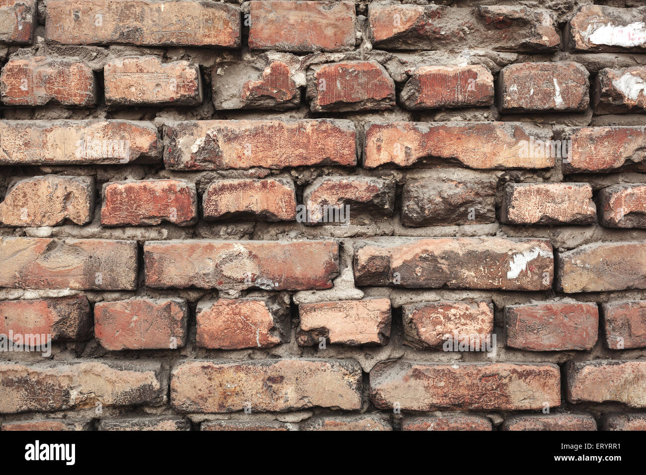 Background of colorful brick wall texture. brickwork. Peeling paint ...