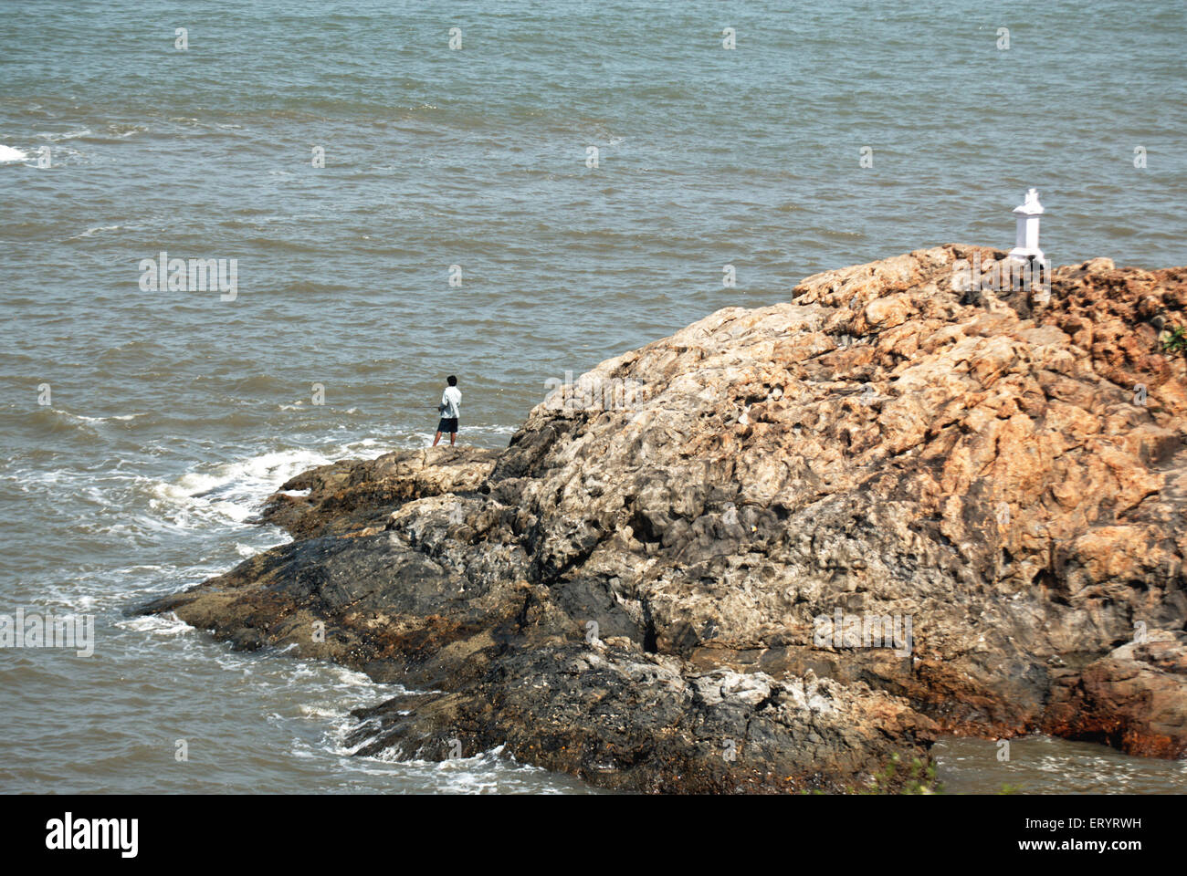 Goan man fishing at vagator beach ; Goa ; India 8 May 2008 Stock Photo ...