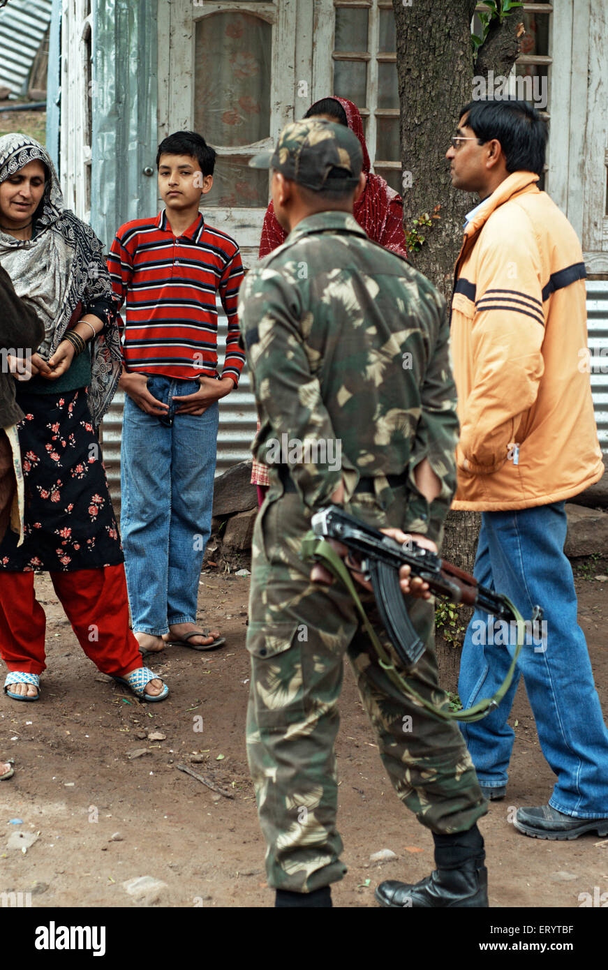 Border security force soldier interact with villager of Urusa ; Uri ; Jammu and Kashmir ; India ...