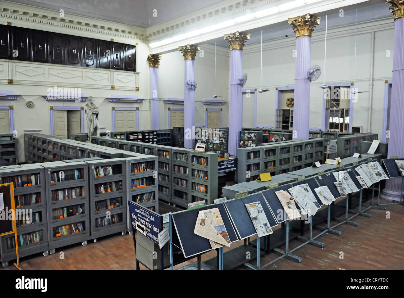 Newspaper stand and book shelves in town hall asiatic library Bombay ...
