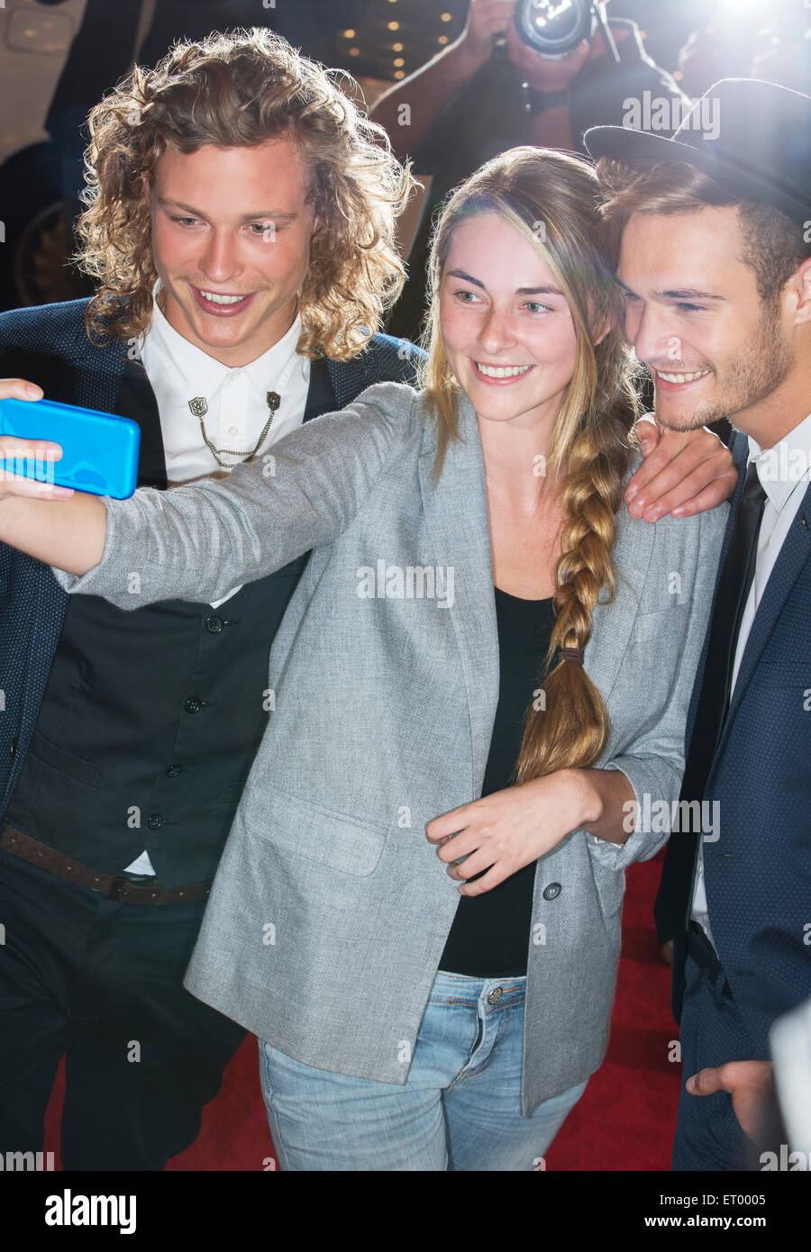 Fan taking selfie with celebrities at event Stock Photo - Alamy