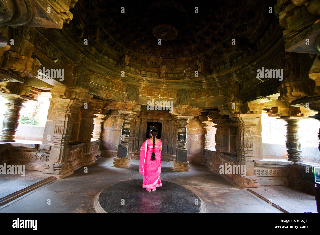 Woman praying in jain old temple kamal basti at Belgaum ; Karnataka ...