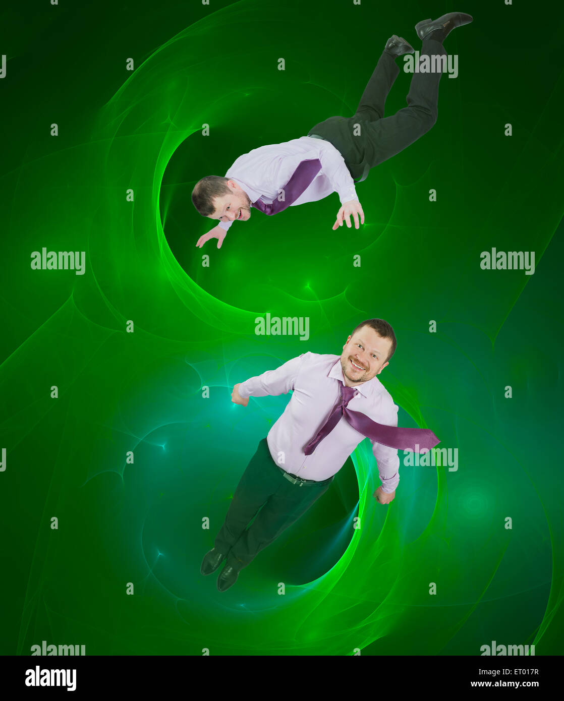 Businessman falling down with green abstract background Stock Photo - Alamy