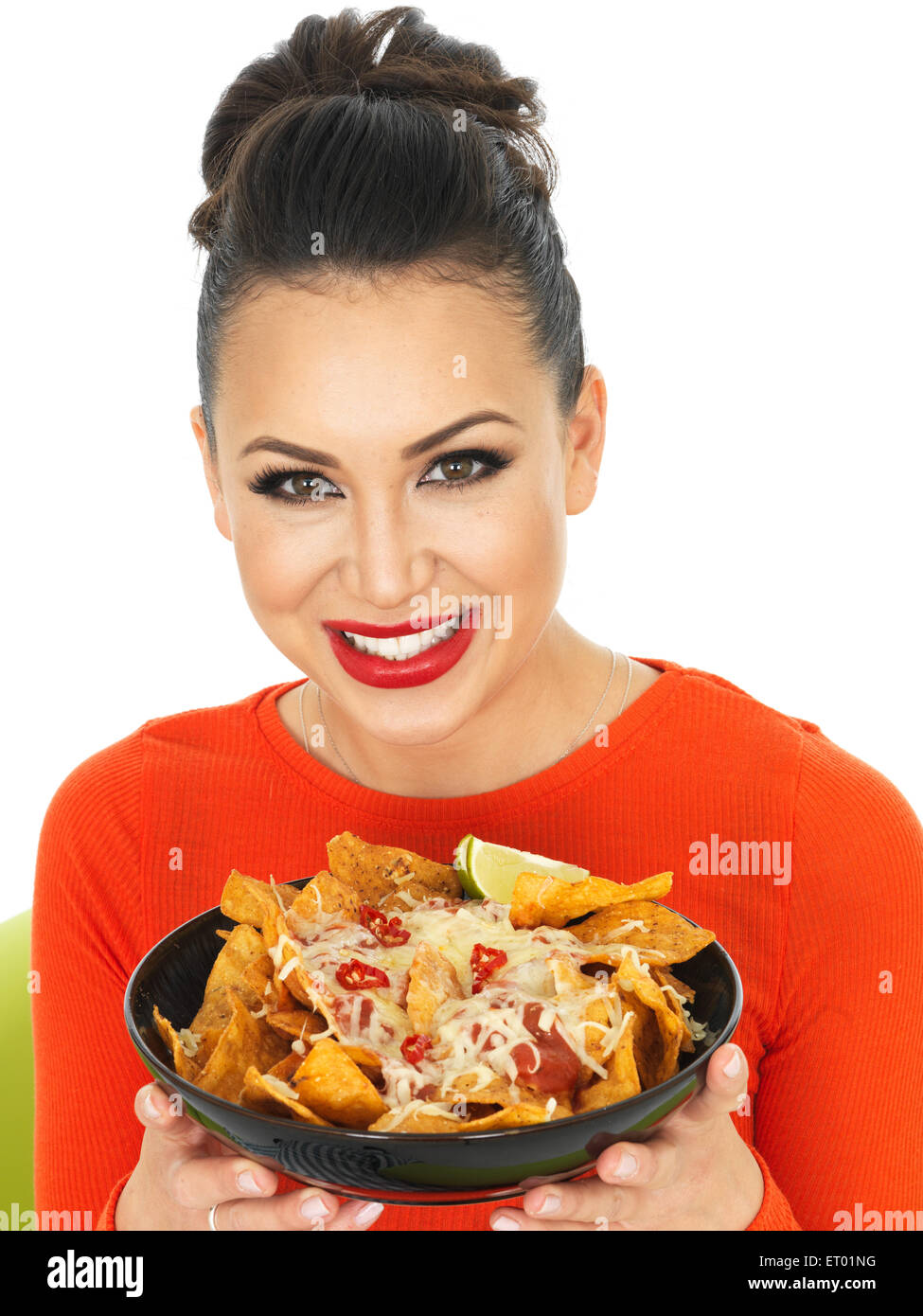 Young Hispanic Woman With A Dish Of Mexican Style Nachos Covered In ...