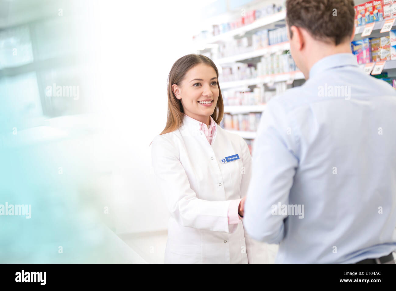 Young woman talking pharmacist hi-res stock photography and images - Alamy