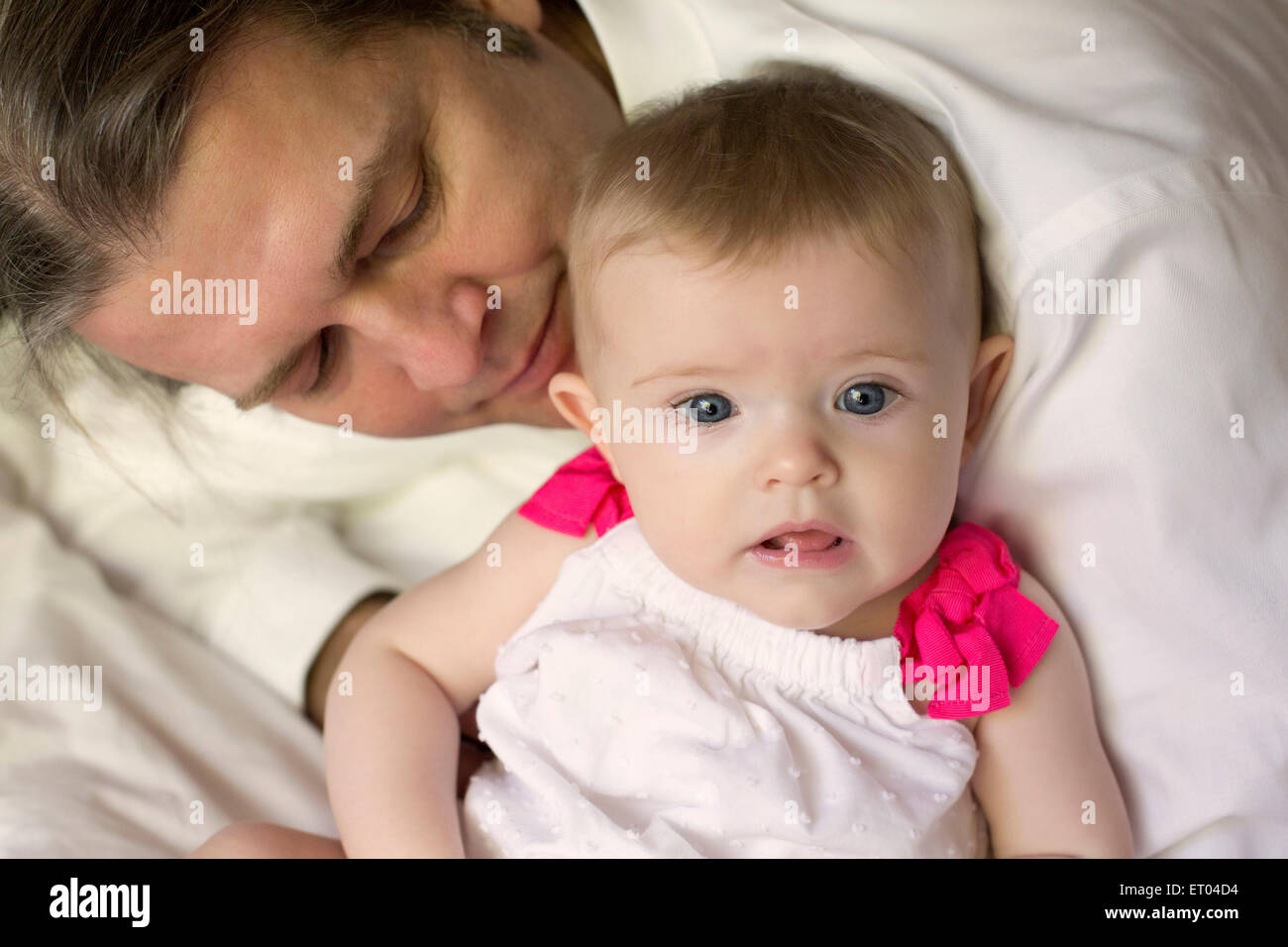 father smiling at his baby daughter Stock Photo - Alamy
